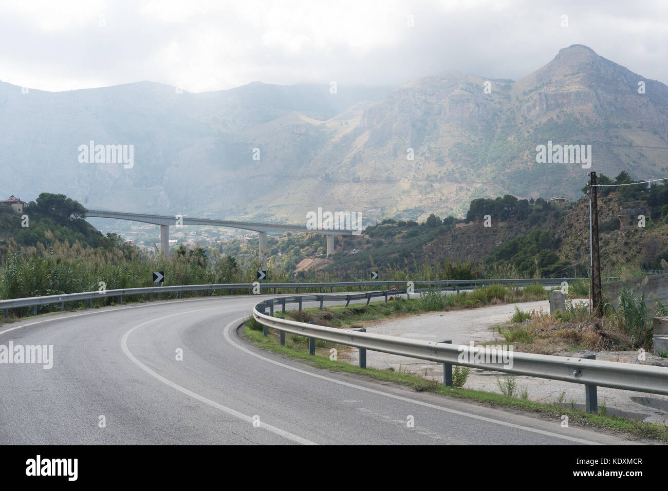 A view of countryside, a road and a bridge near Palermo airport. From a ...