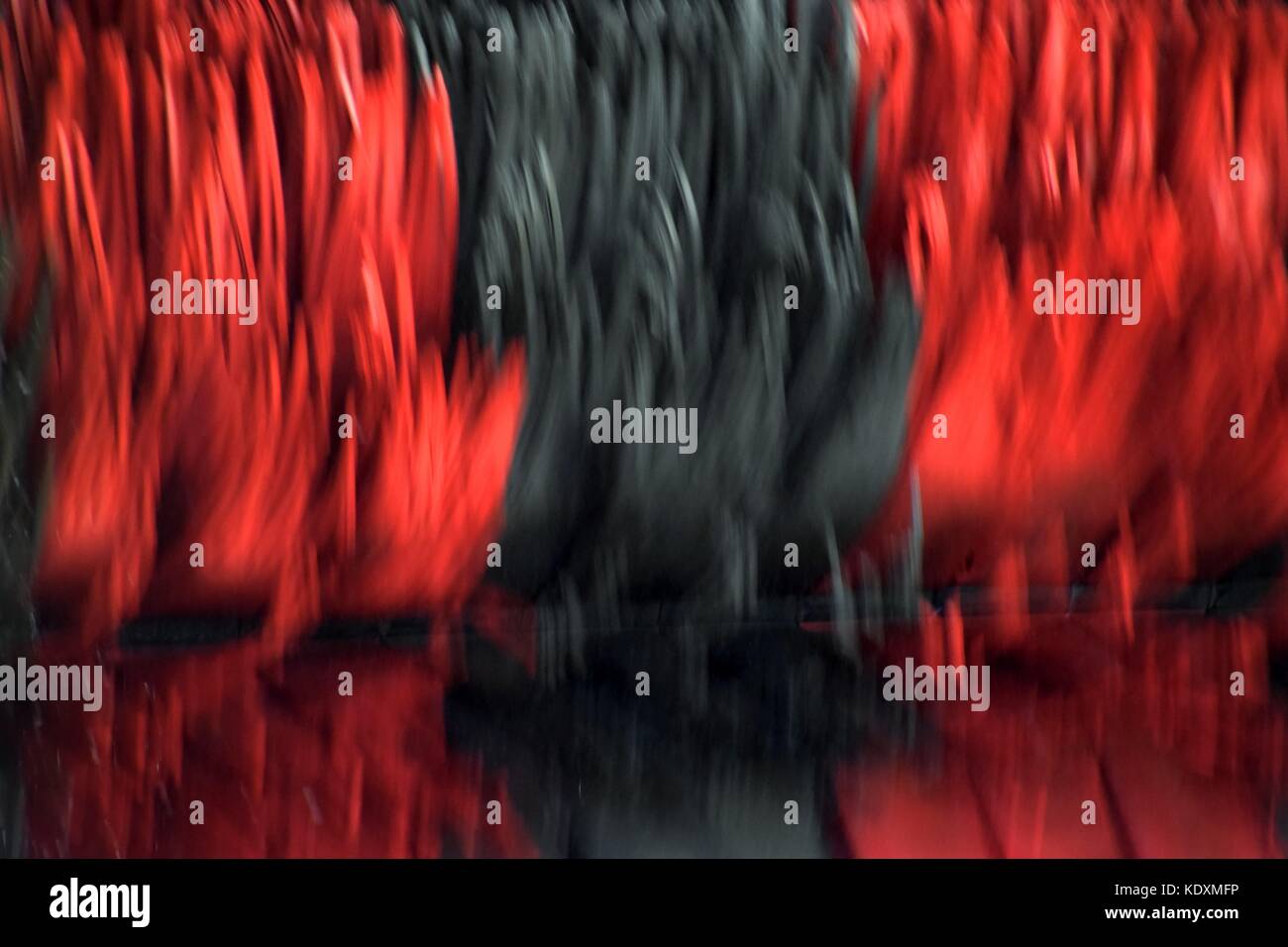 rotating flap System in a car wash, Abstract car wash in red and black ...