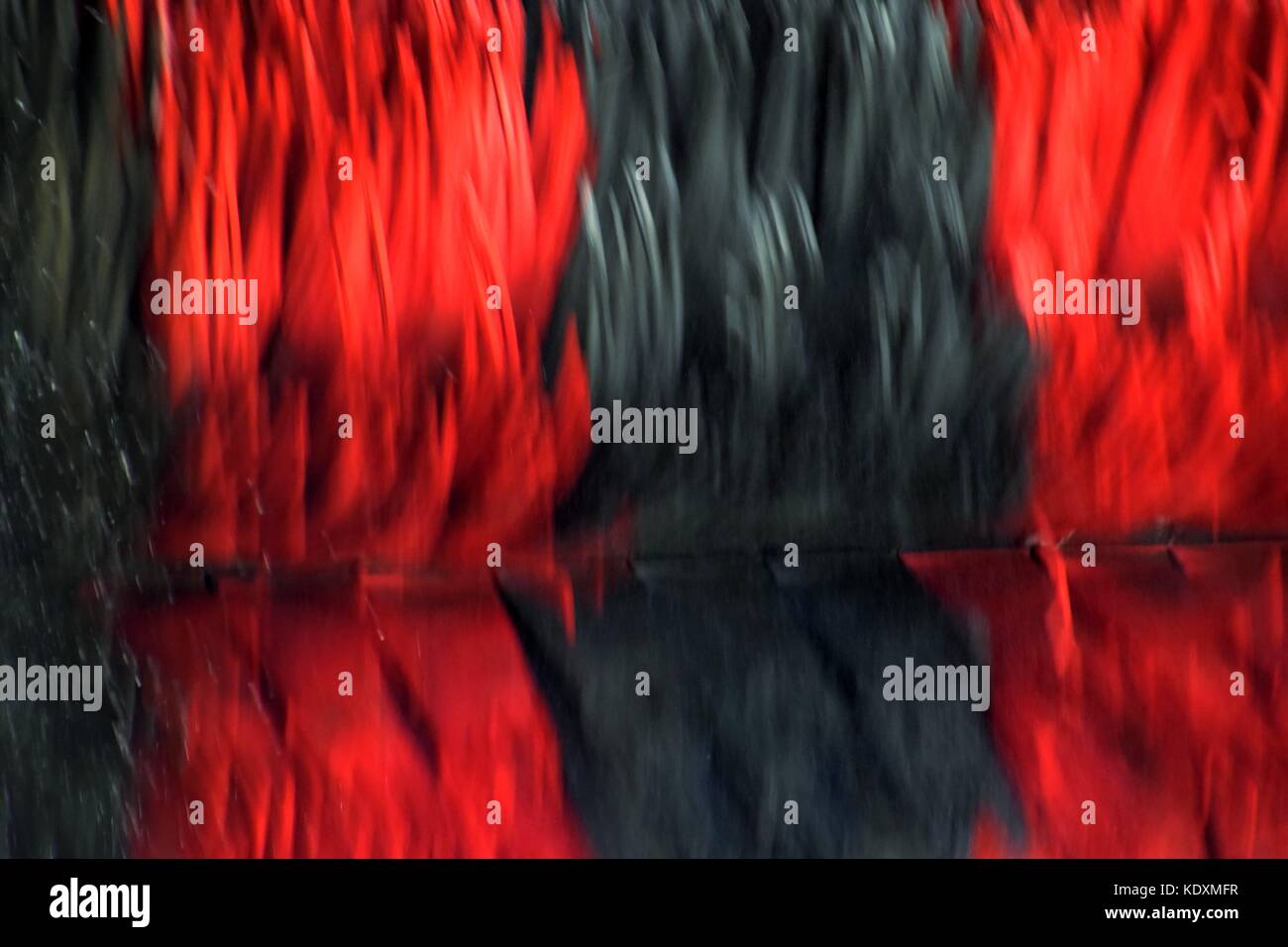 rotating flap System in a car wash, Abstract car wash in red and black ...