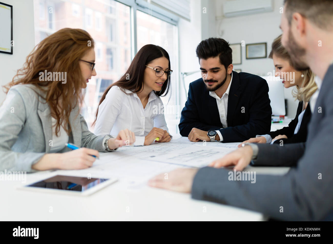 Group of architects working together on project Stock Photo - Alamy