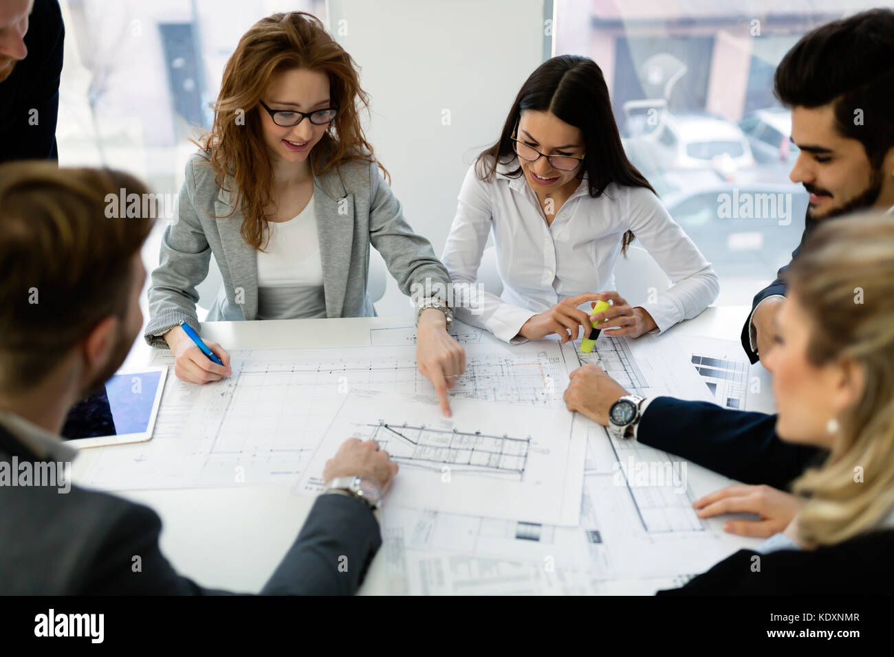 Group of architects working together on project Stock Photo - Alamy