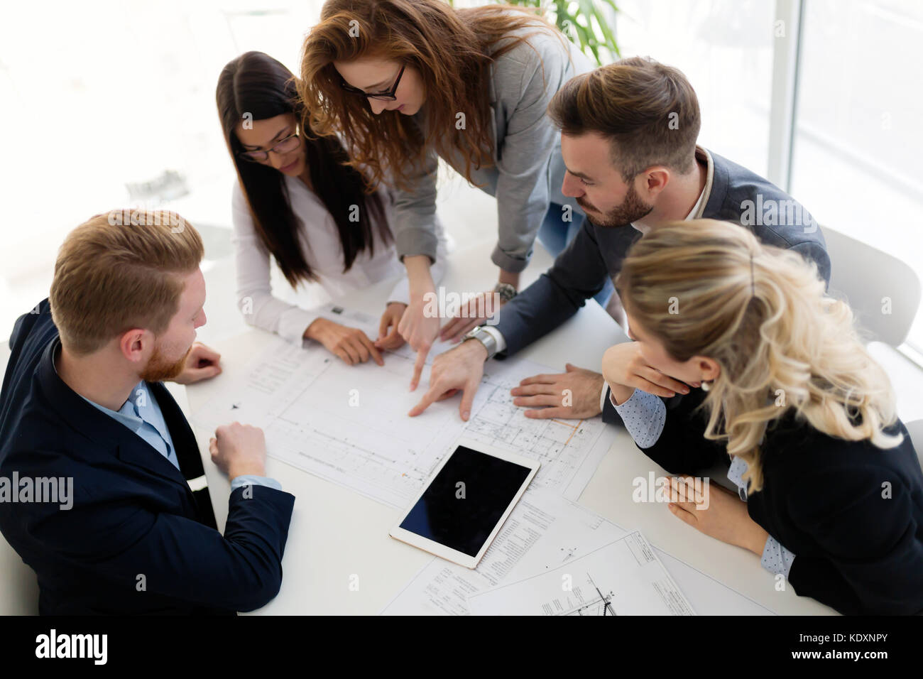 Group of architects working together on project Stock Photo - Alamy