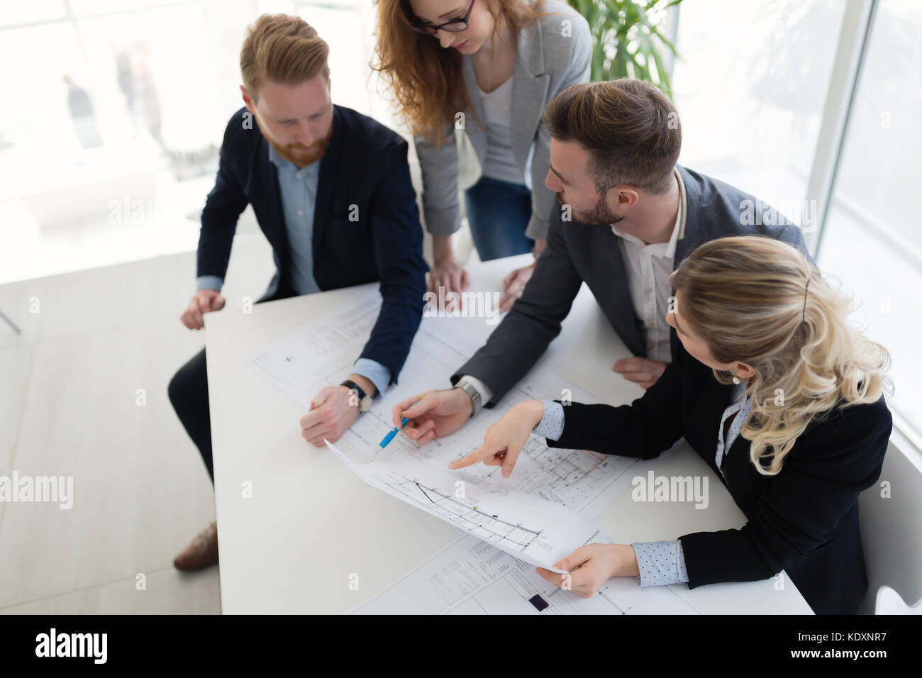 Group of architects working together on project Stock Photo - Alamy