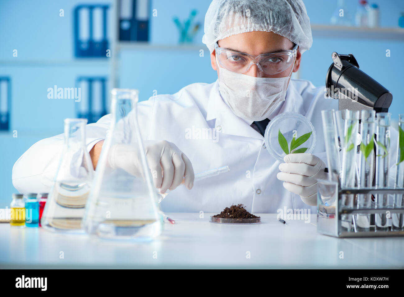Male scientist researcher doing experiment in a laboratory Stock Photo ...