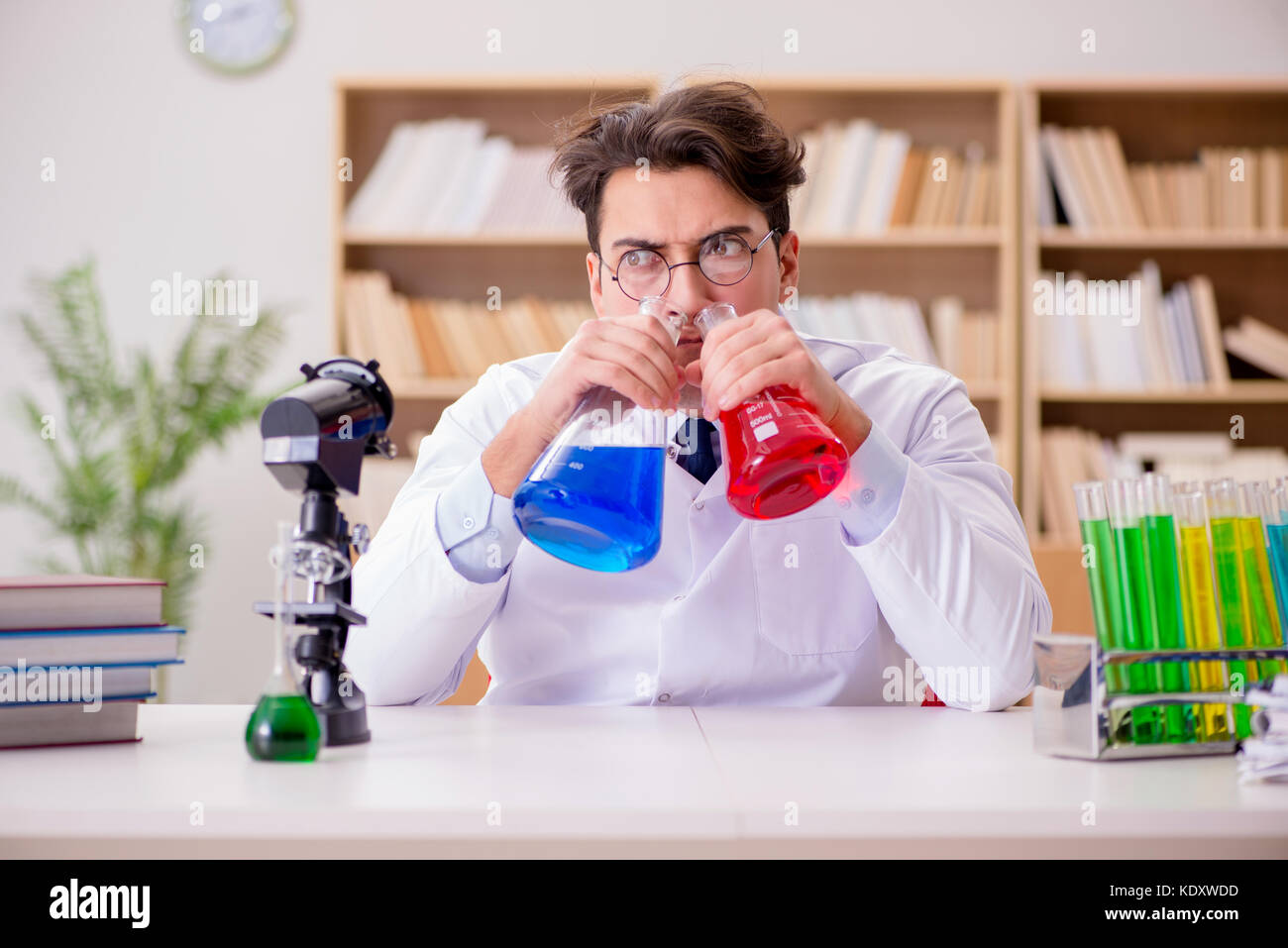 Mad crazy scientist doctor doing experiments in a laboratory Stock ...