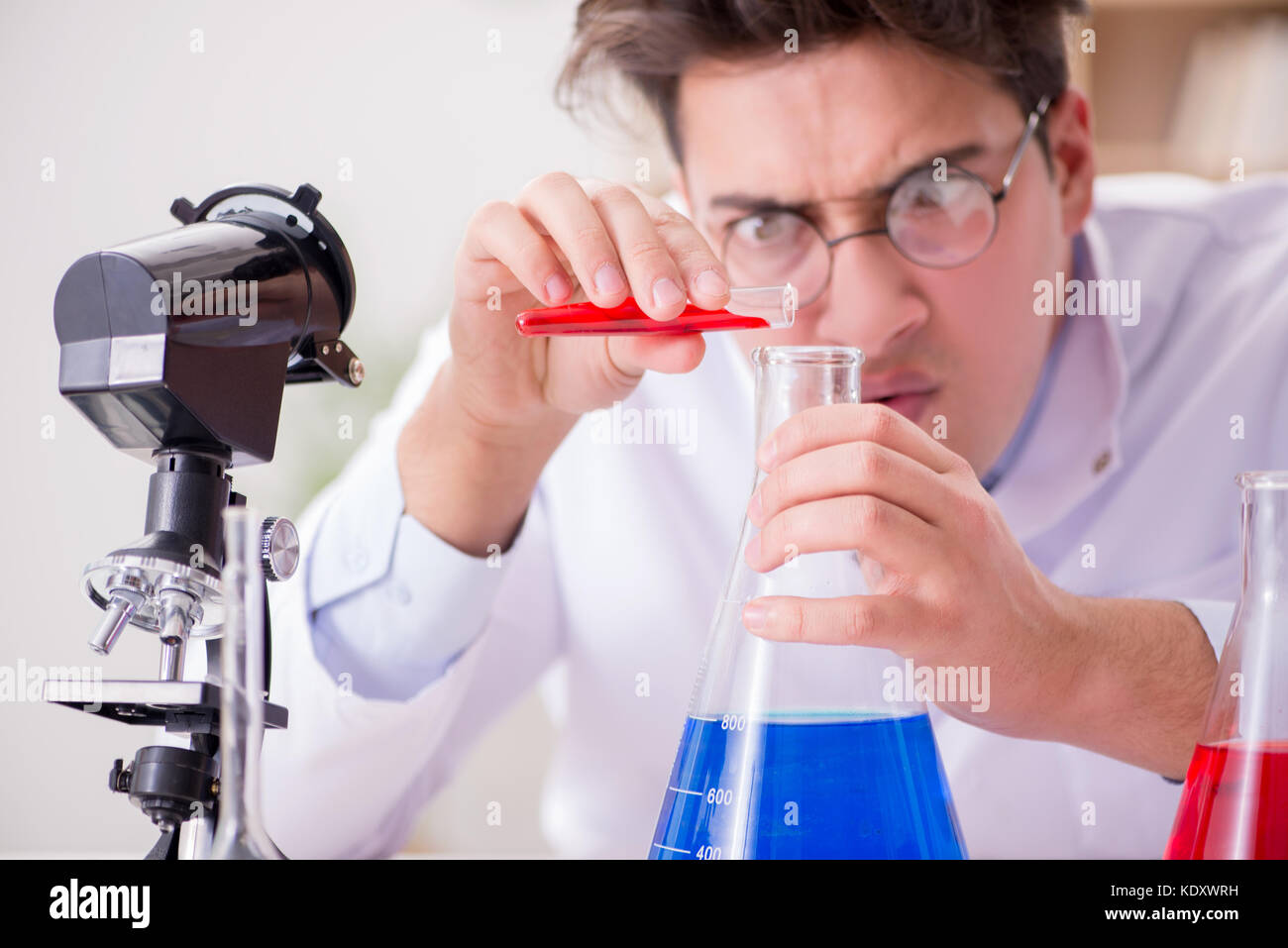 Mad crazy scientist doctor doing experiments in a laboratory Stock ...