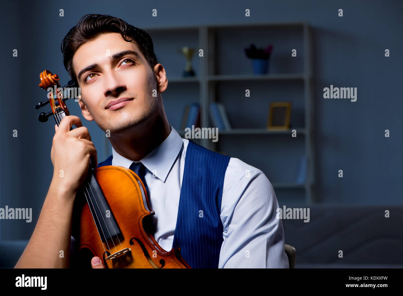 Young musician man practicing playing violin at home Stock Photo - Alamy