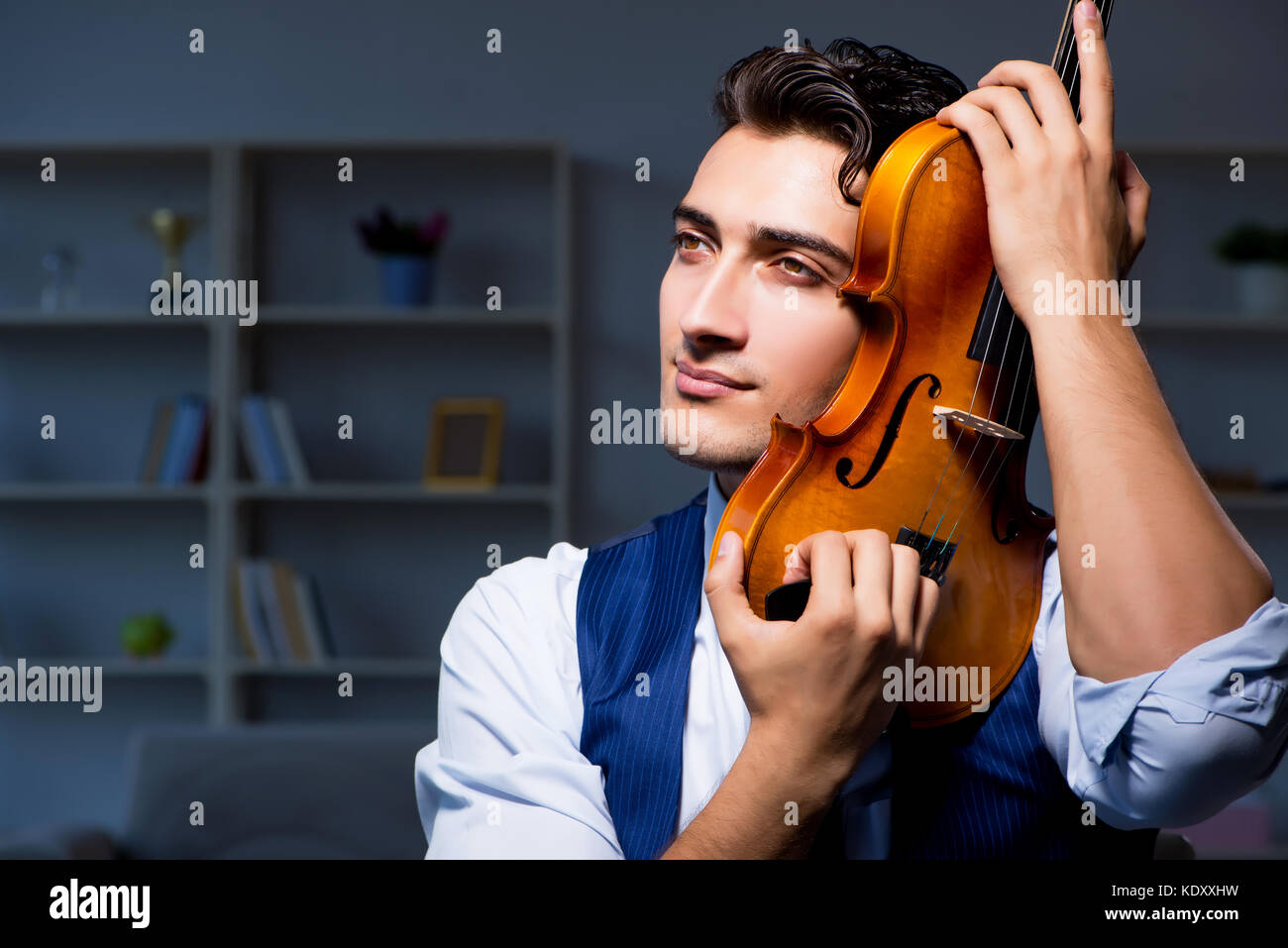 Young musician man practicing playing violin at home Stock Photo - Alamy