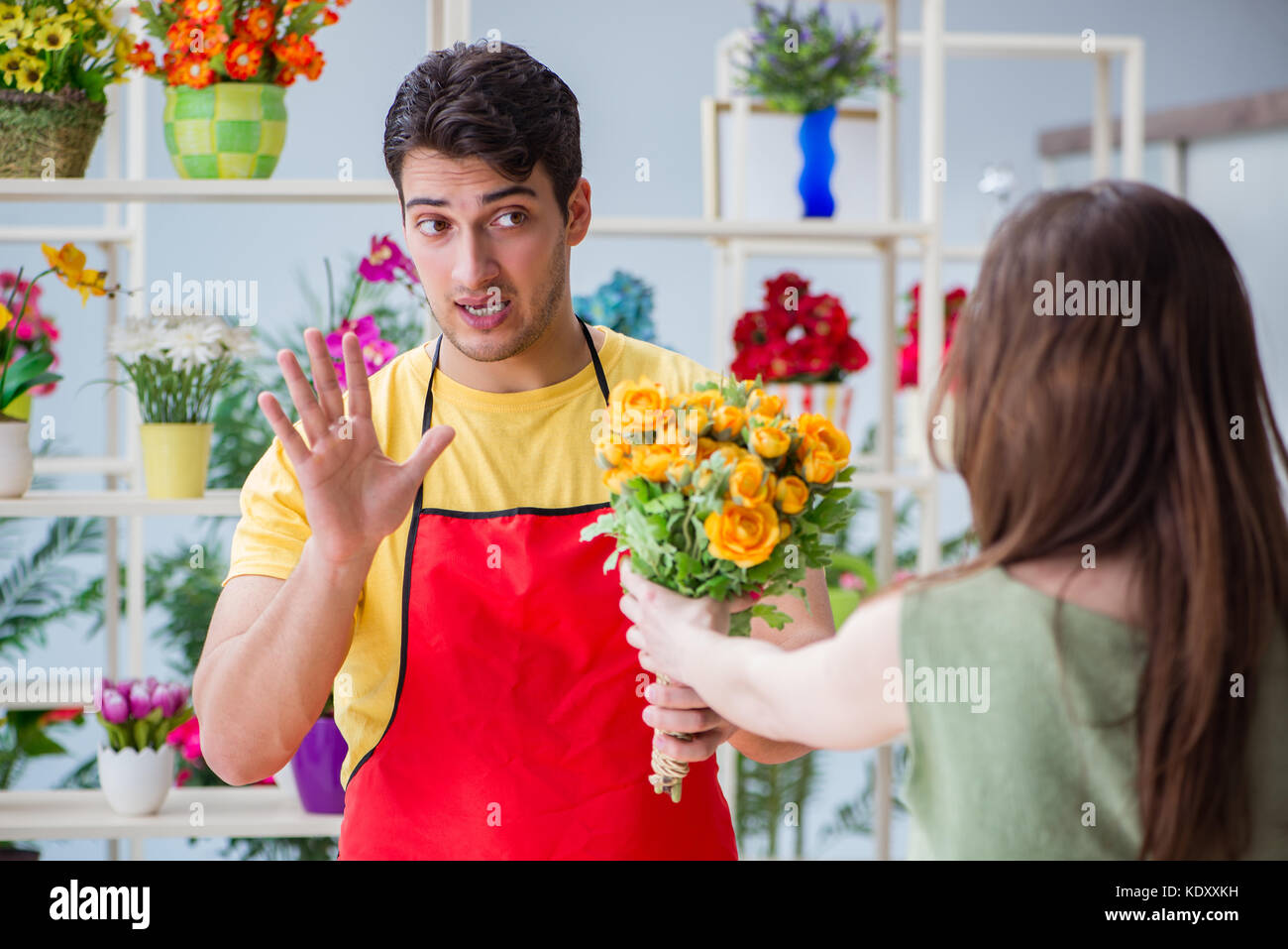 Florist selling flowers in a flower shop Stock Photo - Alamy