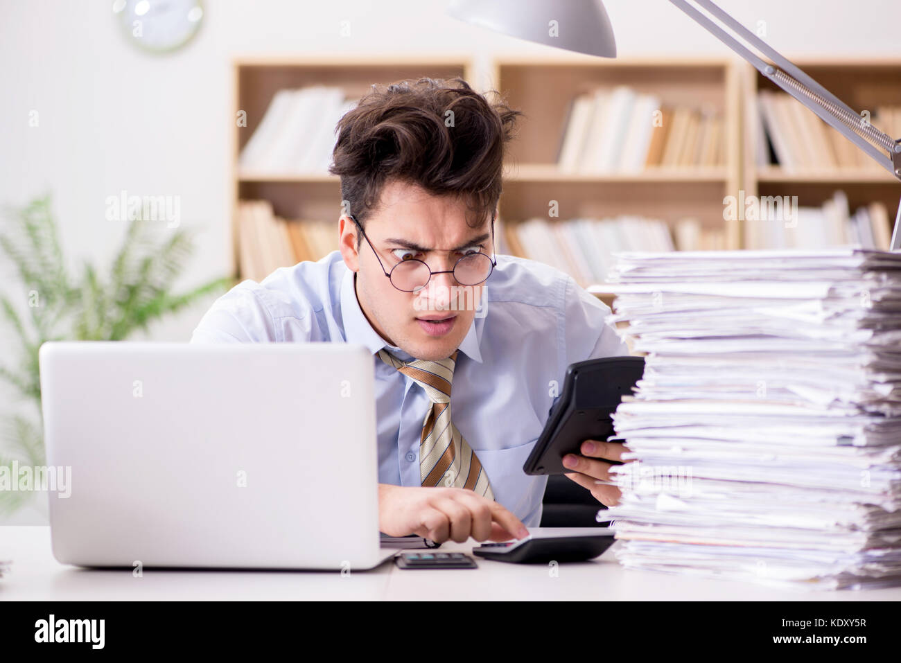 Funny accountant bookkeeper working in the office Stock Photo - Alamy