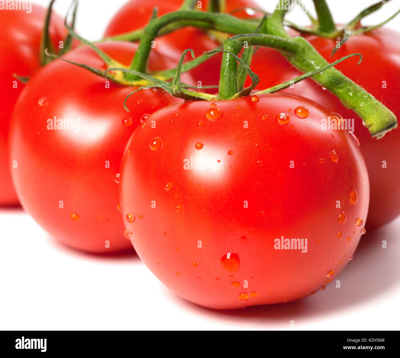 Ripe wet tomato with water drops on white background Stock Photo - Alamy