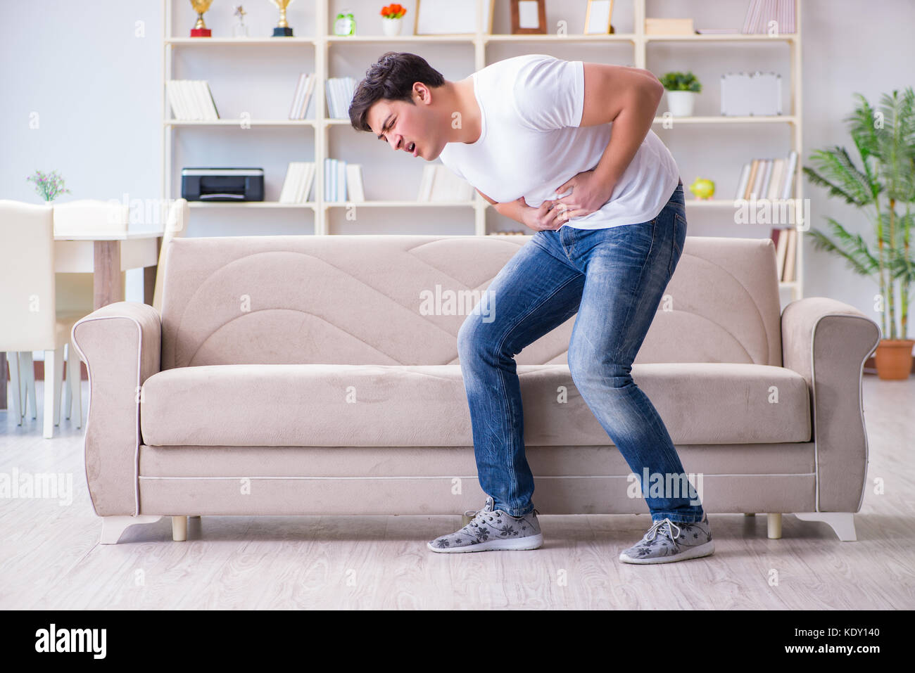 Man suffering from sick stomach and vomiting Stock Photo - Alamy