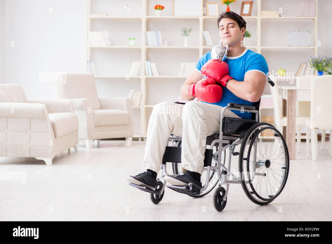 Disabled boxer at wheelchair recovering from injury Stock Photo - Alamy