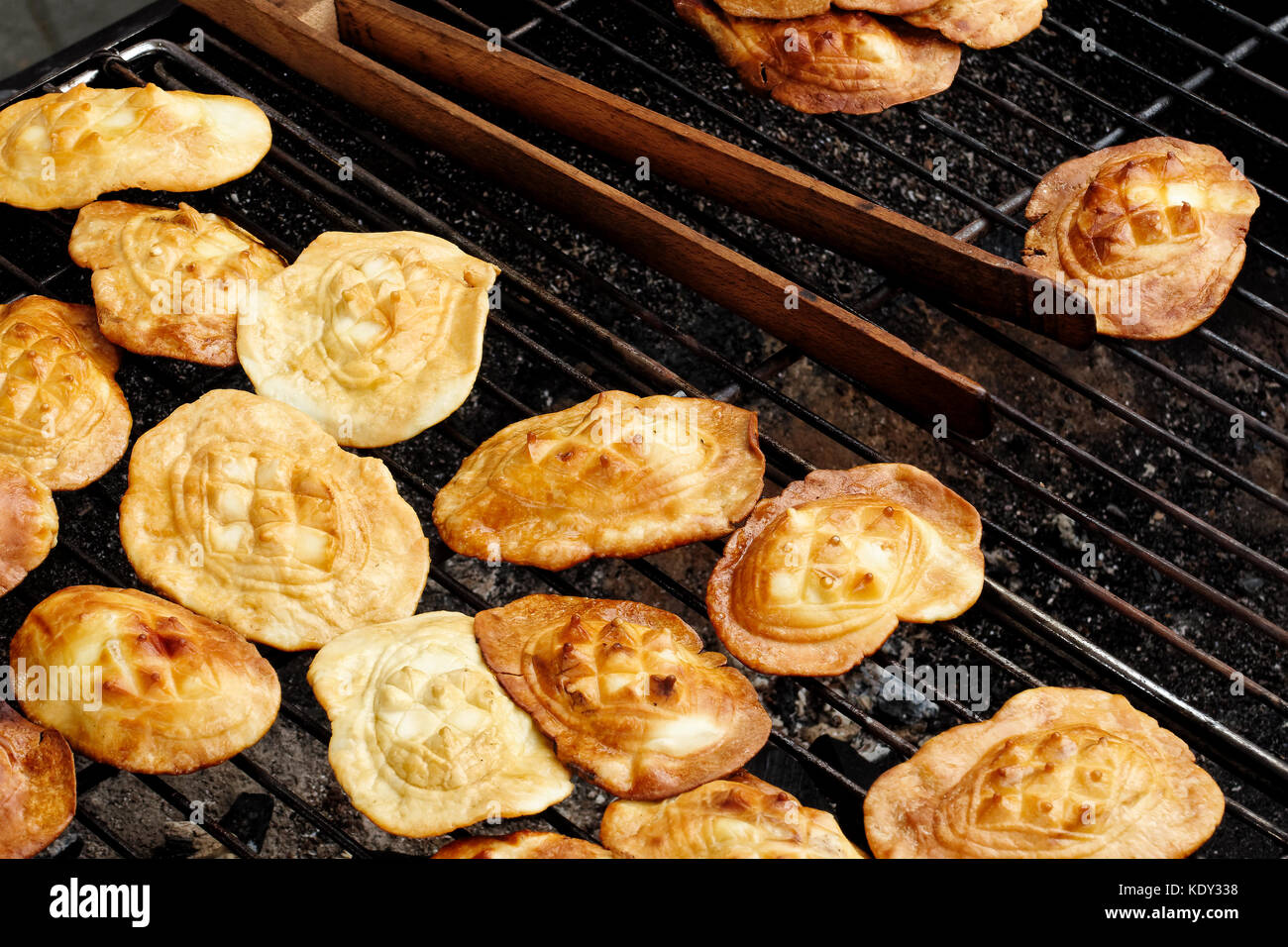 Oscypek smoked sheep cheese on a grill Stock Photo - Alamy