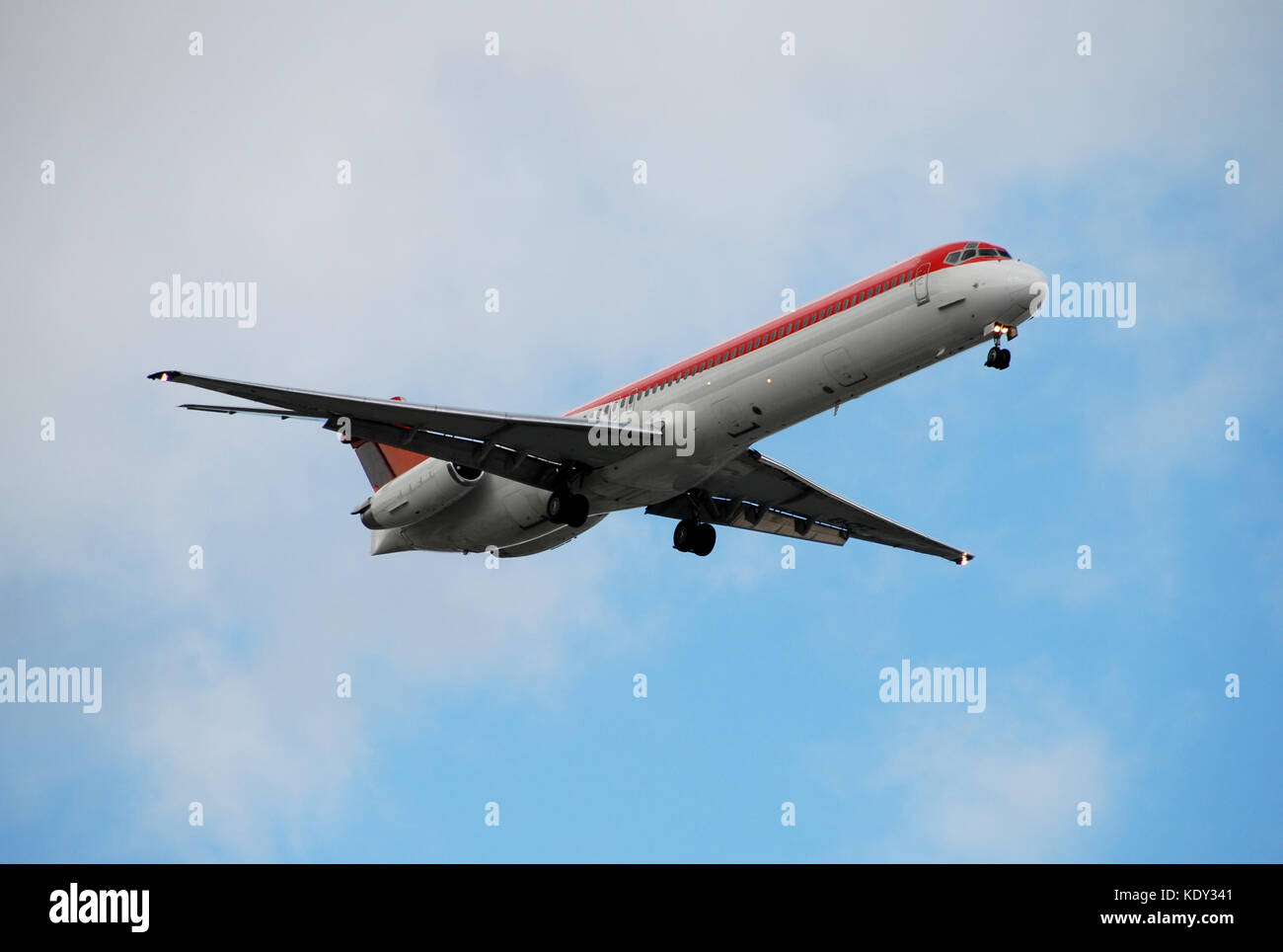 Modern jet airplane descending for landing Stock Photo - Alamy