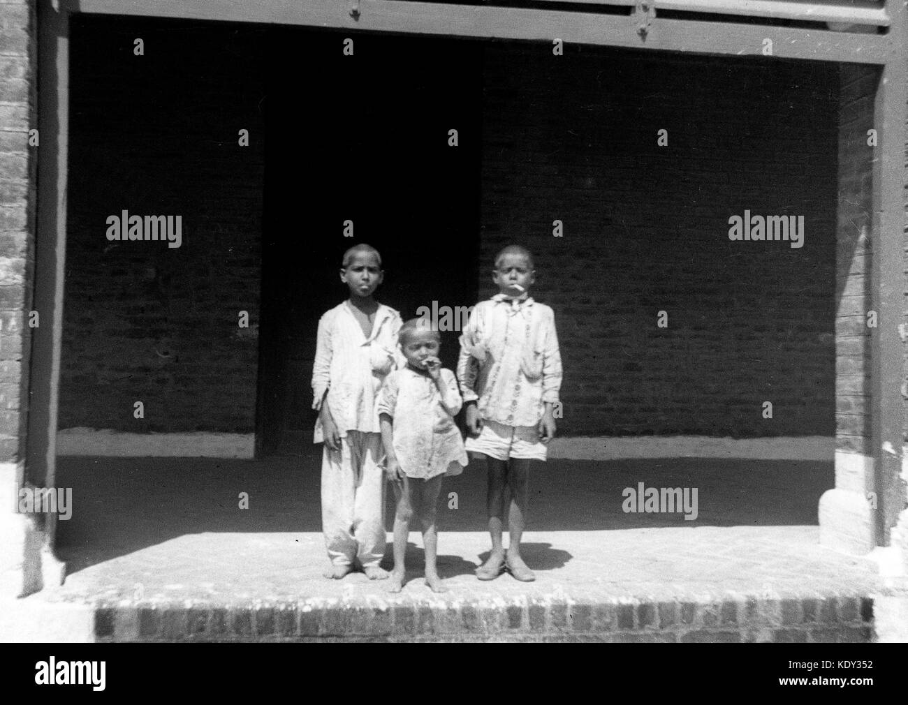 Children smoking cigarettes Black and White Stock Photos & Images - Alamy