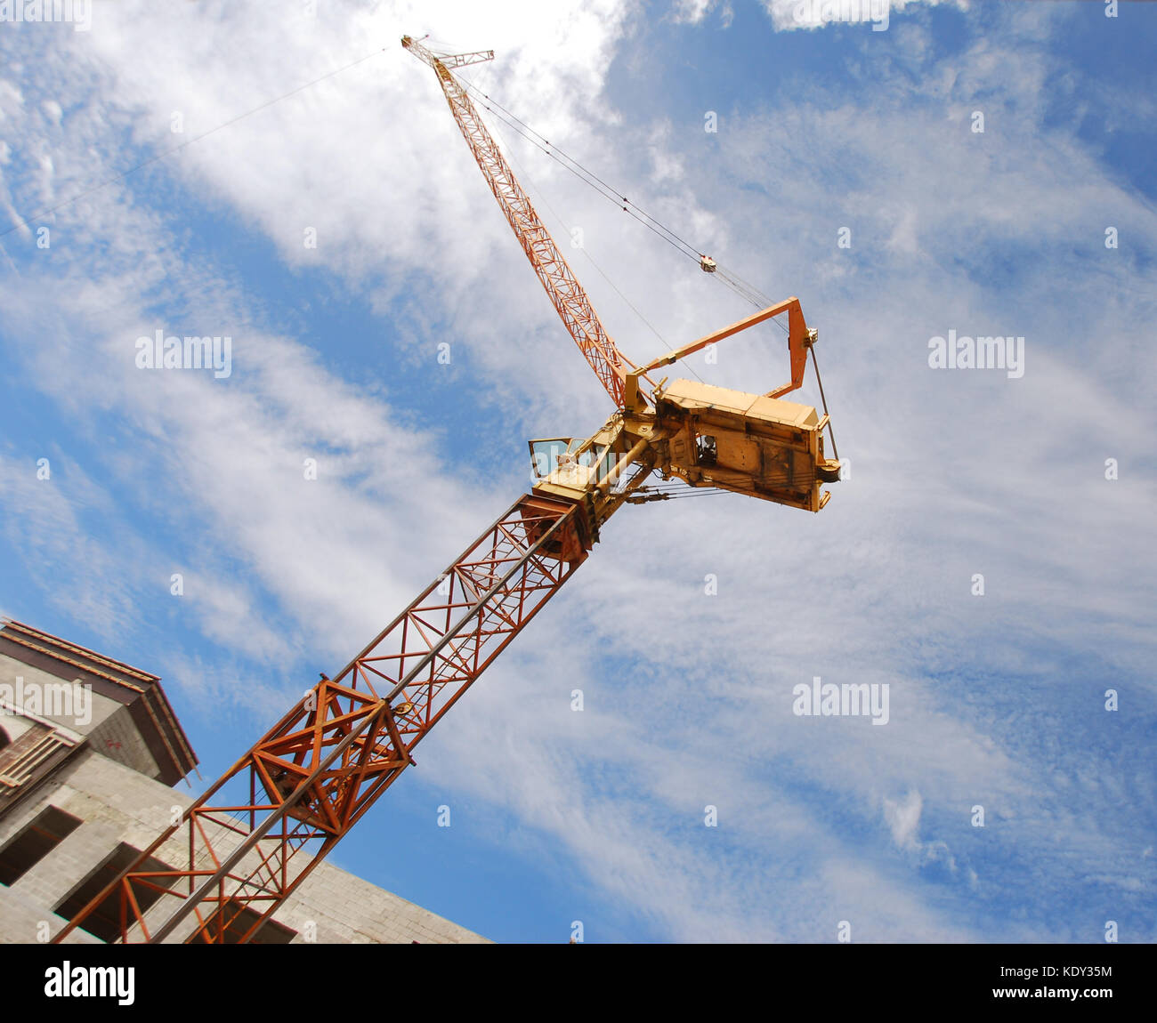 Tall construction crane soaring into the sky Stock Photo - Alamy