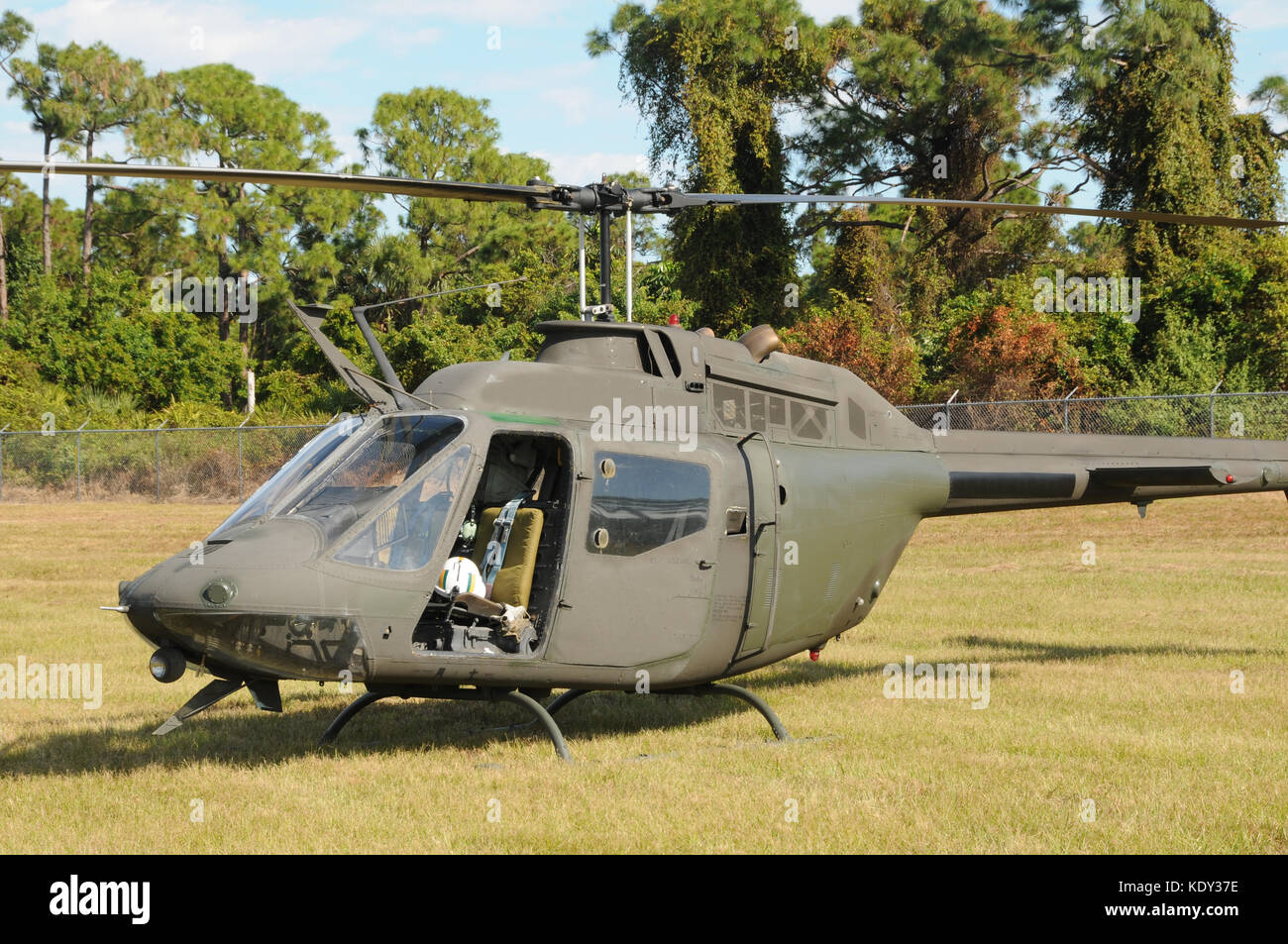 Light utility helicopter on a green field Stock Photo - Alamy