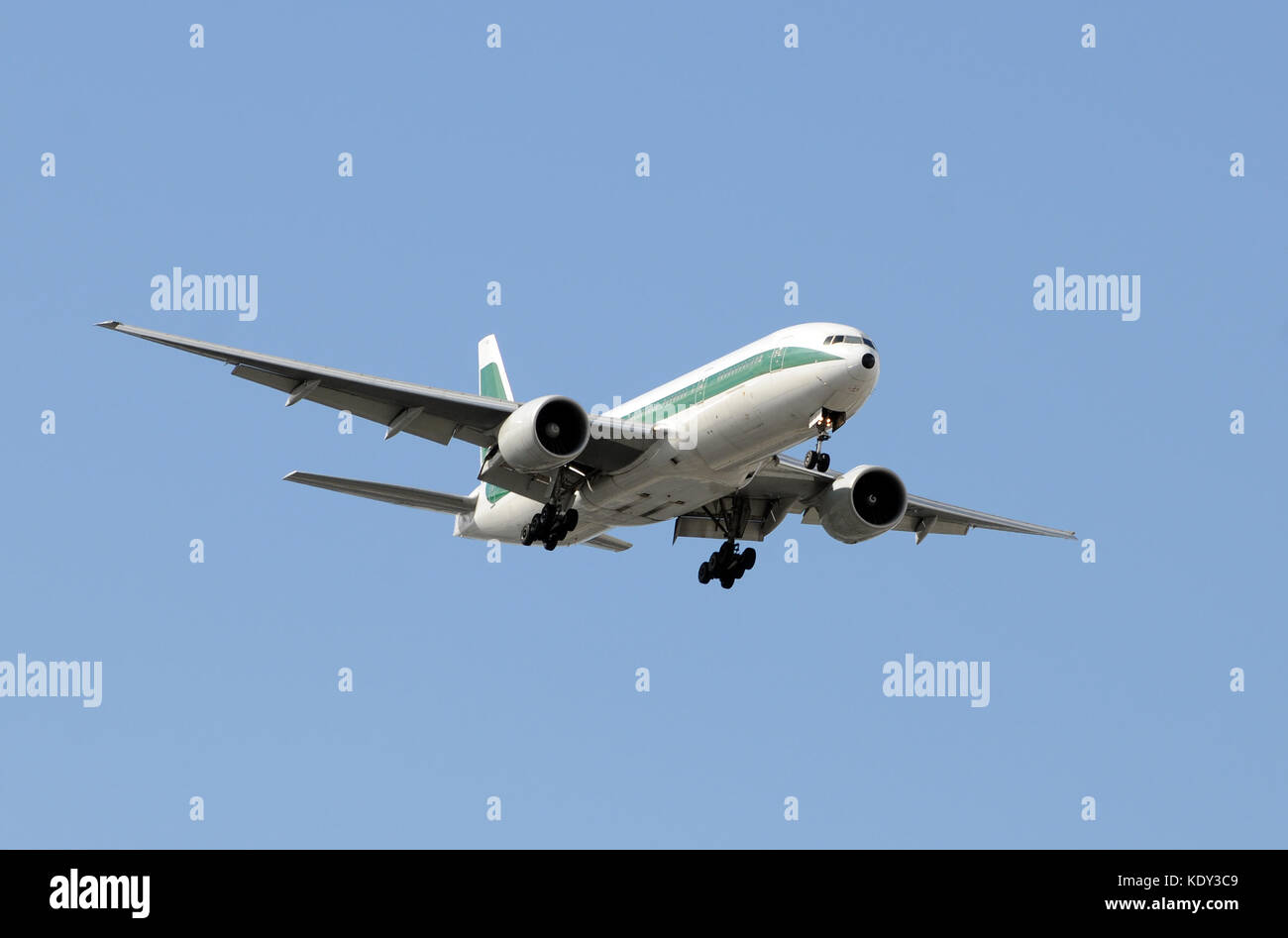 Modern passenger jet airplane arriving at destination Stock Photo - Alamy
