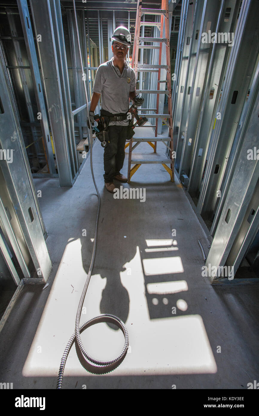 Electrician wiring green home. Ed Begley Jr., and his wife Rachelle ...