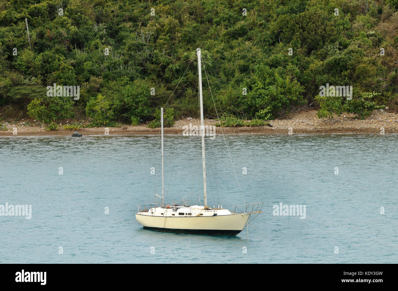 EMpty sailboat anchored near coast Stock Photo - Alamy