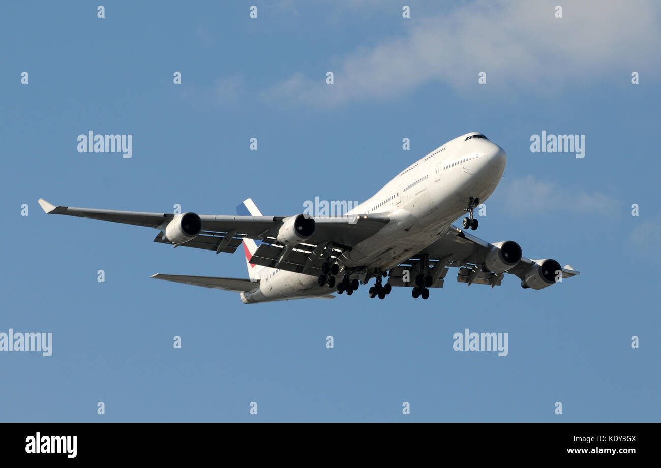heavy jet airplane approaching for landing Stock Photo - Alamy