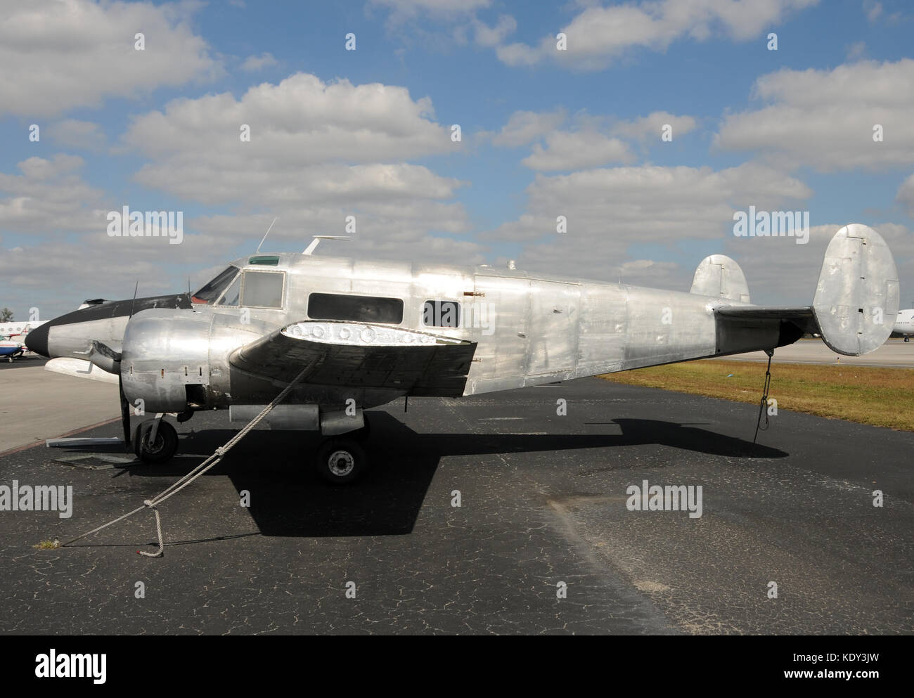 Vintage propeller airplane with bare metal fuselage Stock Photo - Alamy