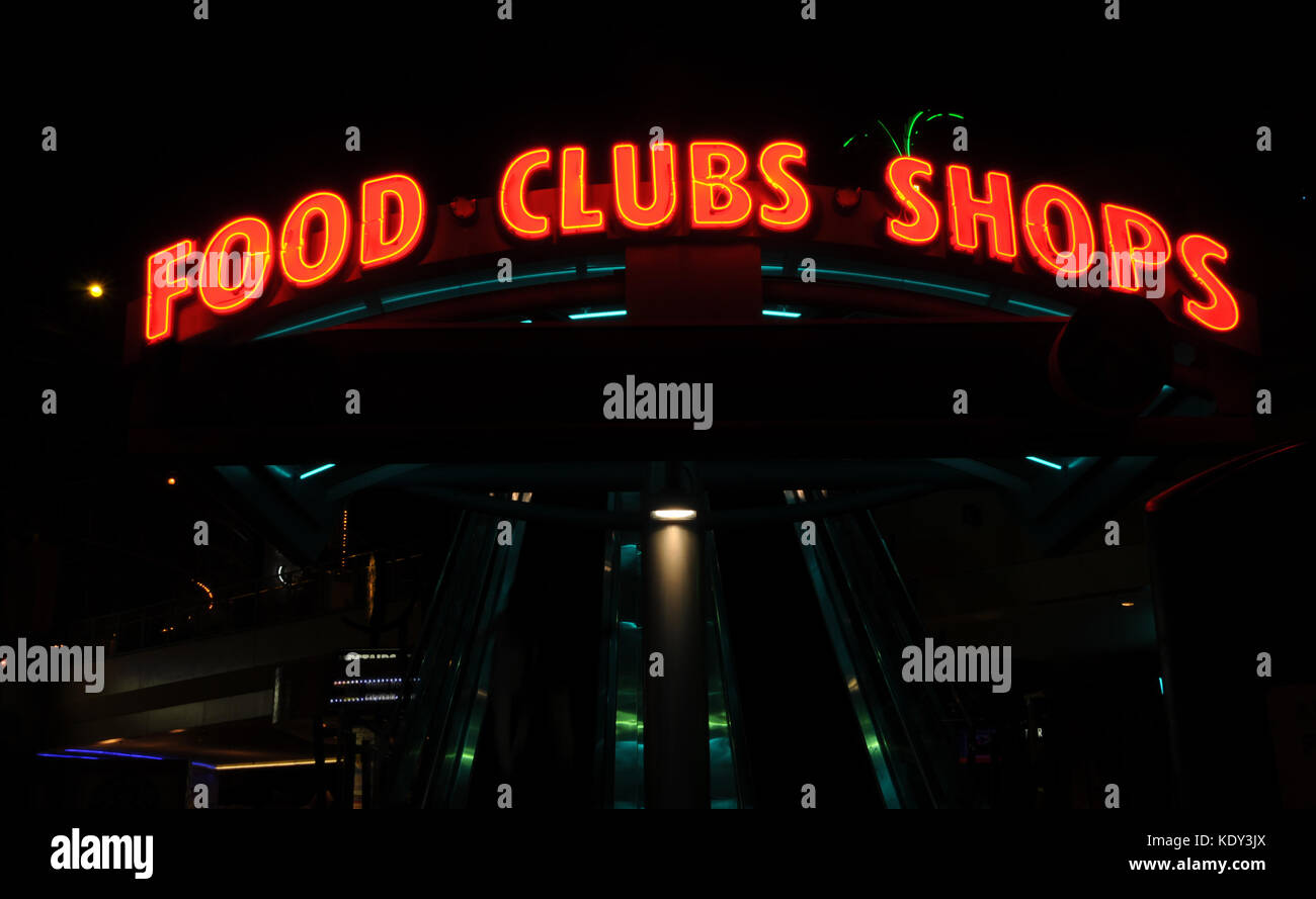 Glowing neon signs to food, clubs and entertainment Stock Photo - Alamy