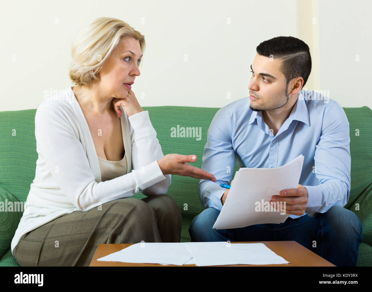 Man woman papers home desk hi-res stock photography and images - Alamy