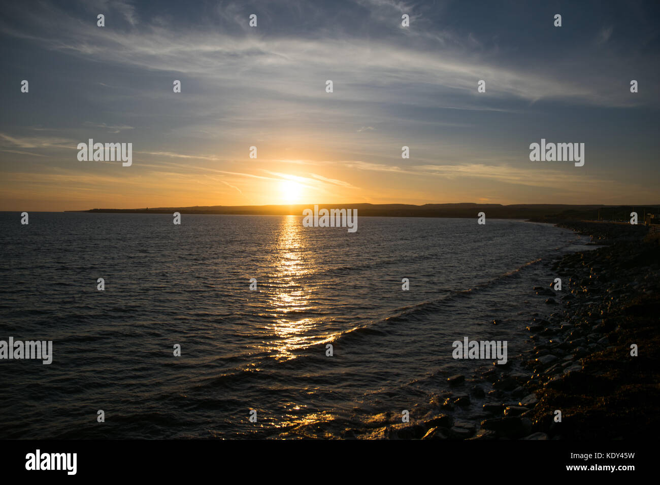 Sunset Irish coast Stock Photo - Alamy