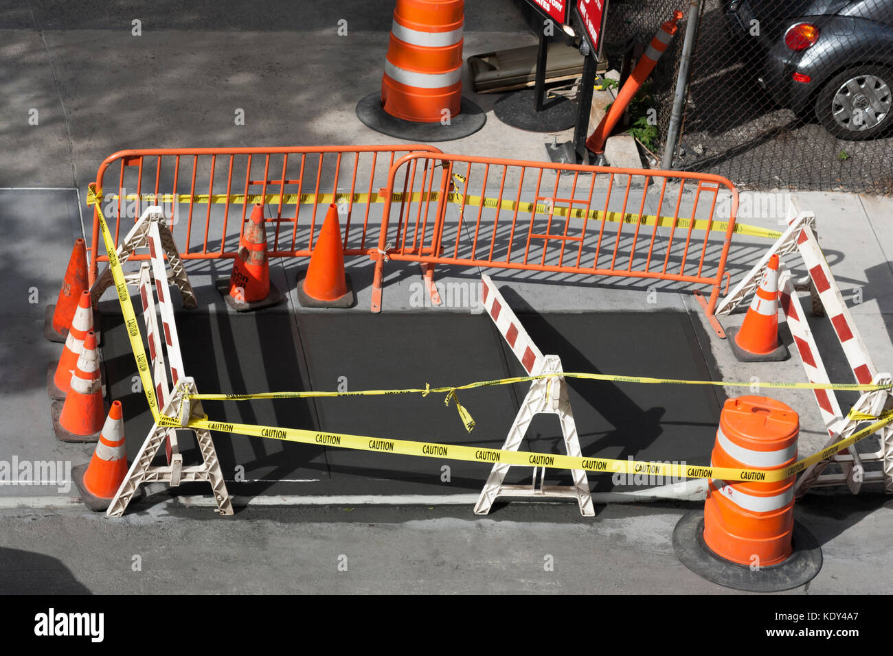 Barrier around wet cement drying on a sidewalk Stock Photo - Alamy
