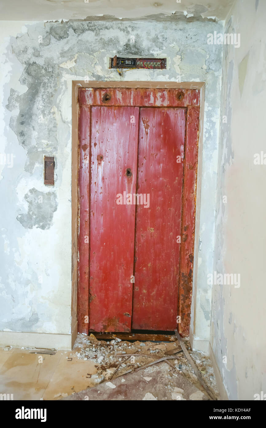 The red doors of an old ruined hotel Stock Photo - Alamy