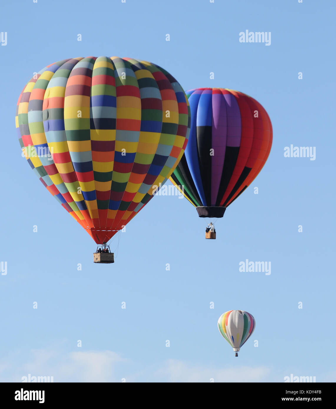 Three hot air balloons floating in the air Stock Photo - Alamy