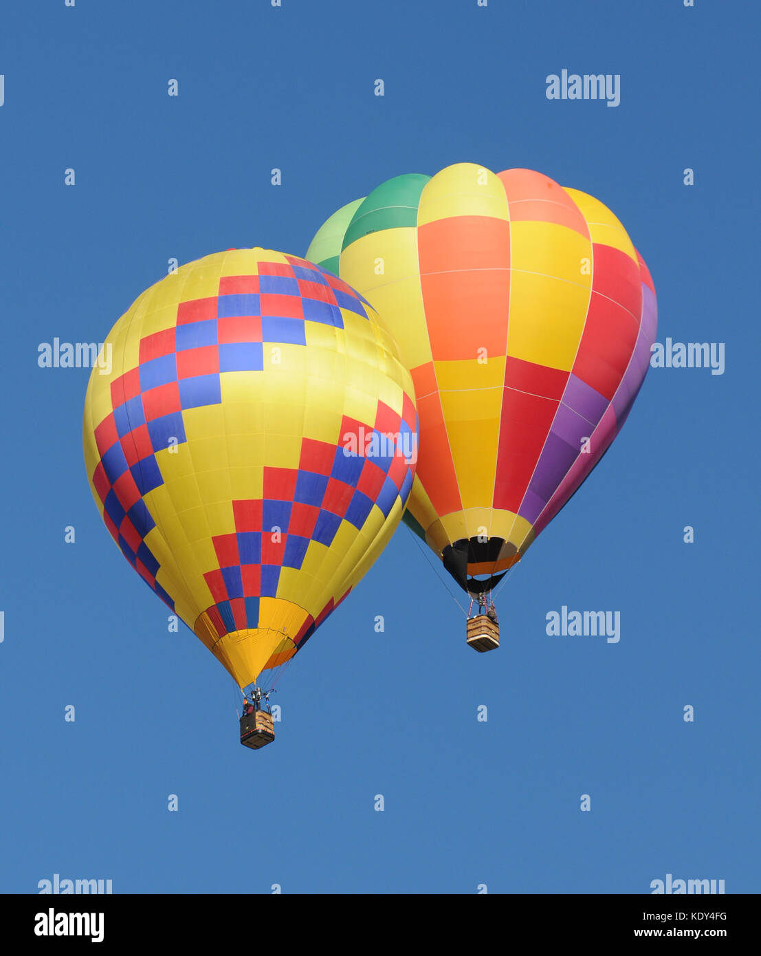 Two colorful hot air balloons floating next to each other Stock Photo ...