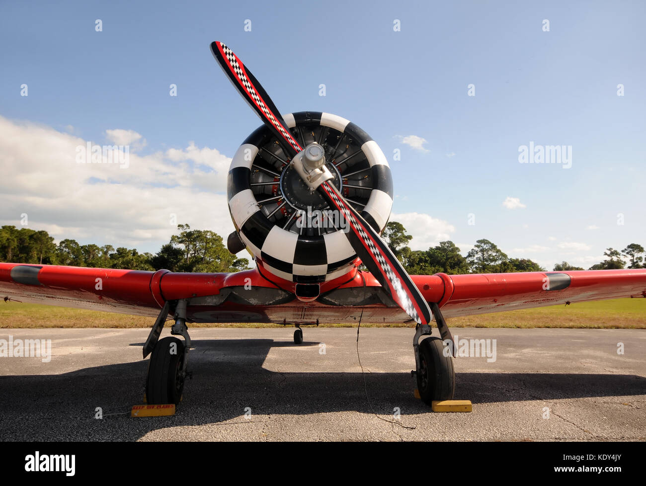 Retro propeller airplane painted red front view Stock Photo - Alamy