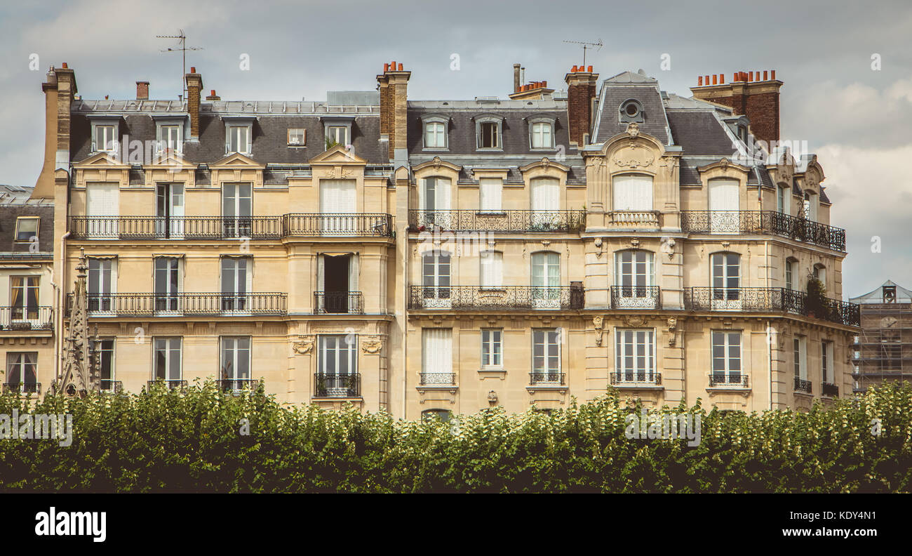 typical facade of parisian apartment building in bad weather gray Stock ...