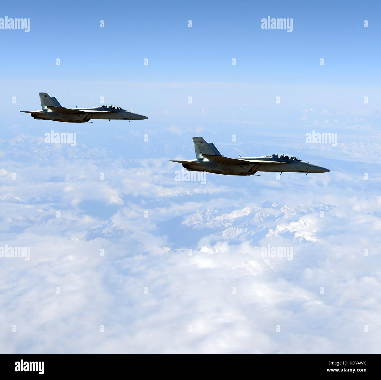 Two modern military jet fighters above mountain tops Stock Photo - Alamy
