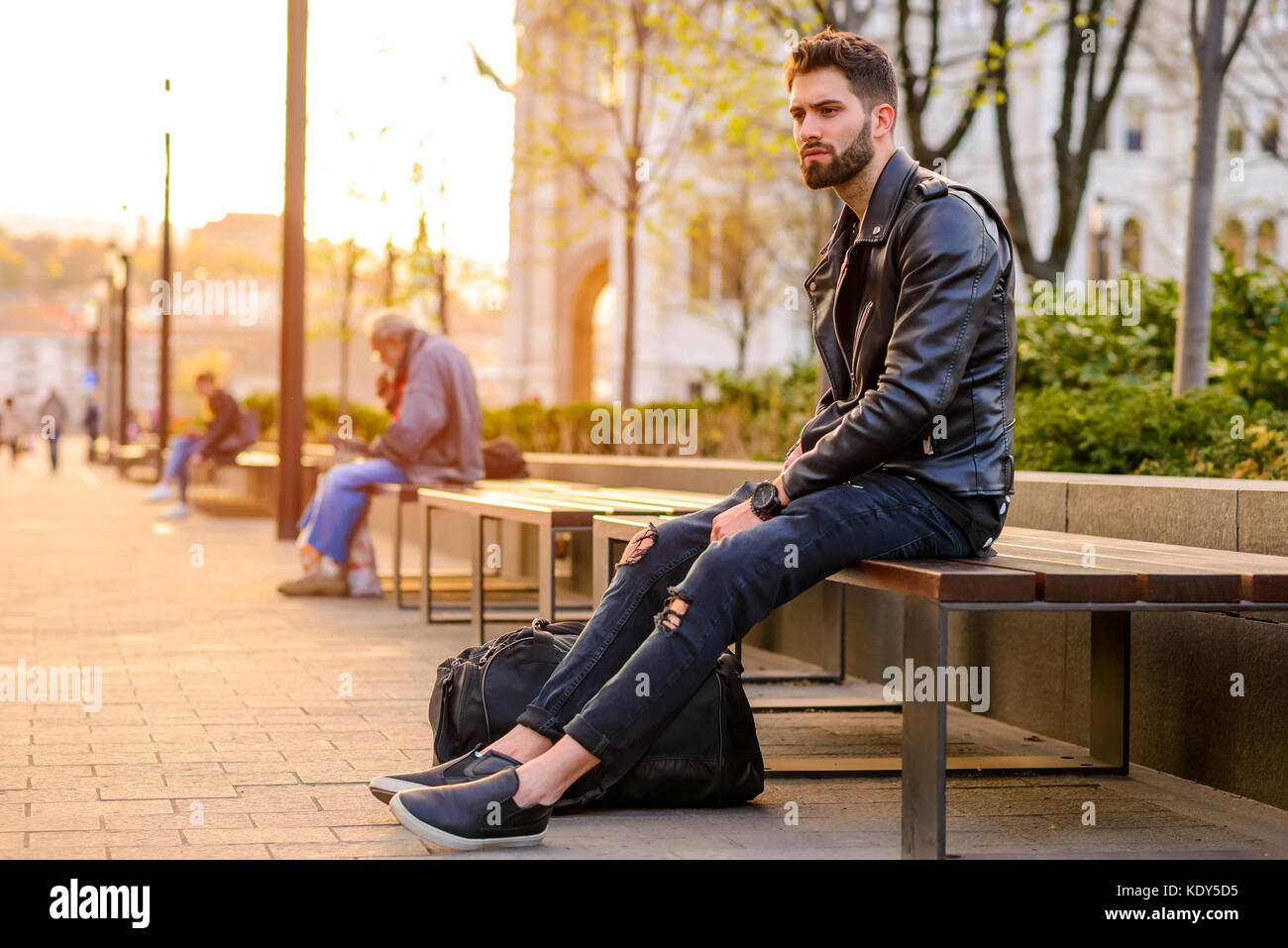 Man Sitting On Bench At Sunset High Resolution Stock Photography and ...