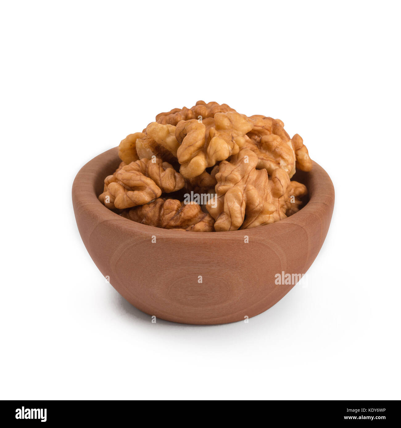 Walnuts shelled in a bowl isolated on white background. Side view ...