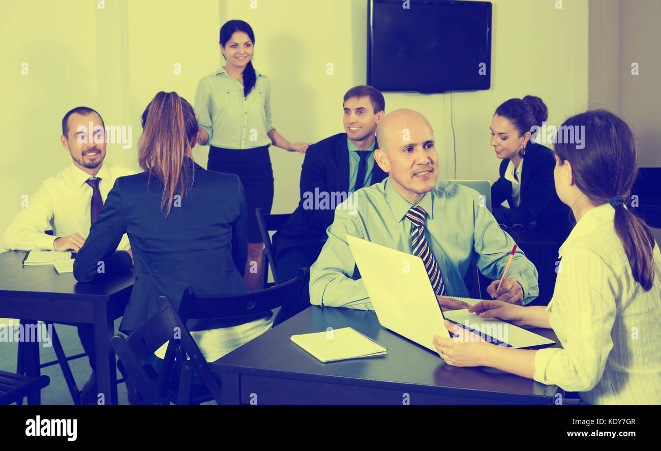 Active worker speaking about issue on project in office Stock Photo - Alamy