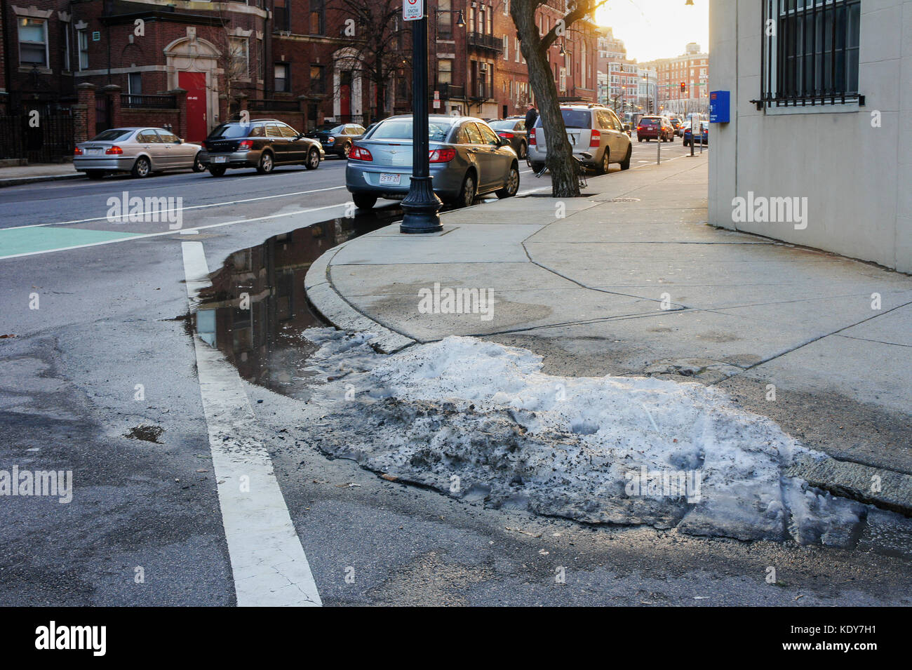 Boston, JAN 25: Sunset cityscape with building, cars and snow on JAN 25 ...