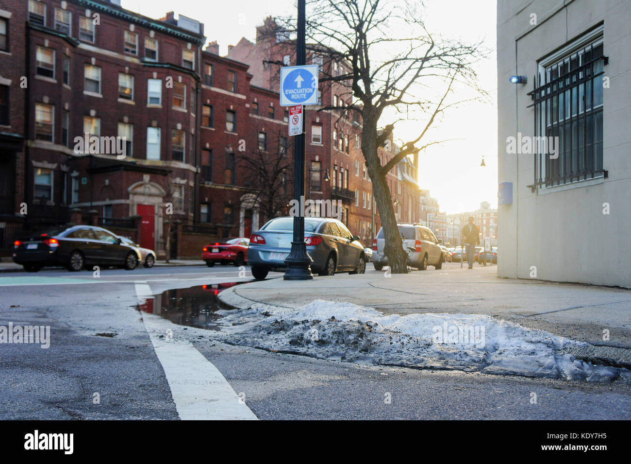 Boston, JAN 25: Sunset cityscape with building, cars and snow on JAN 25 ...