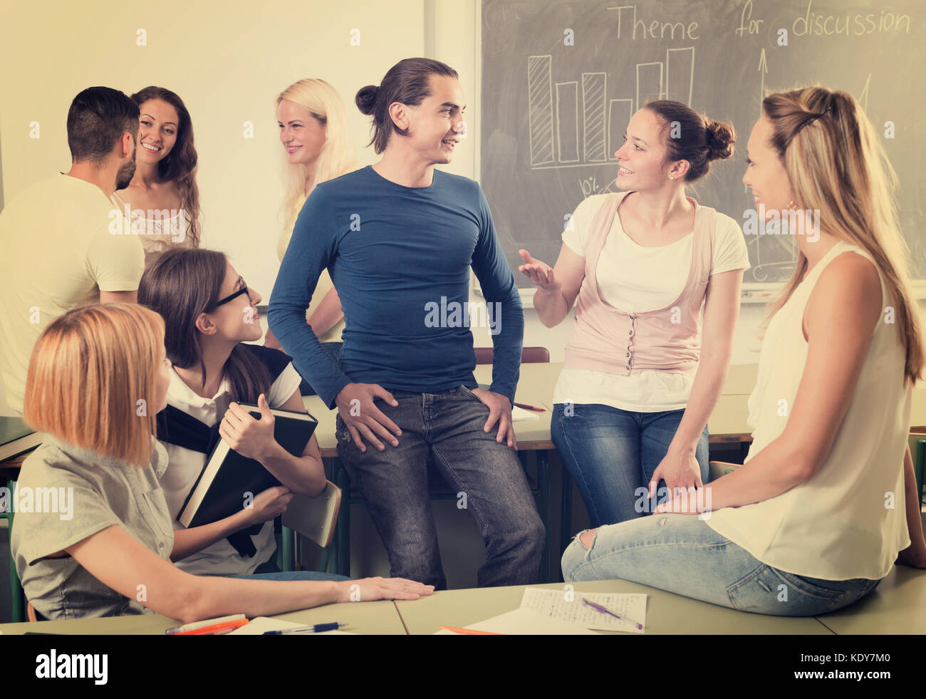 smiling students chatting and smiling at the college Stock Photo - Alamy
