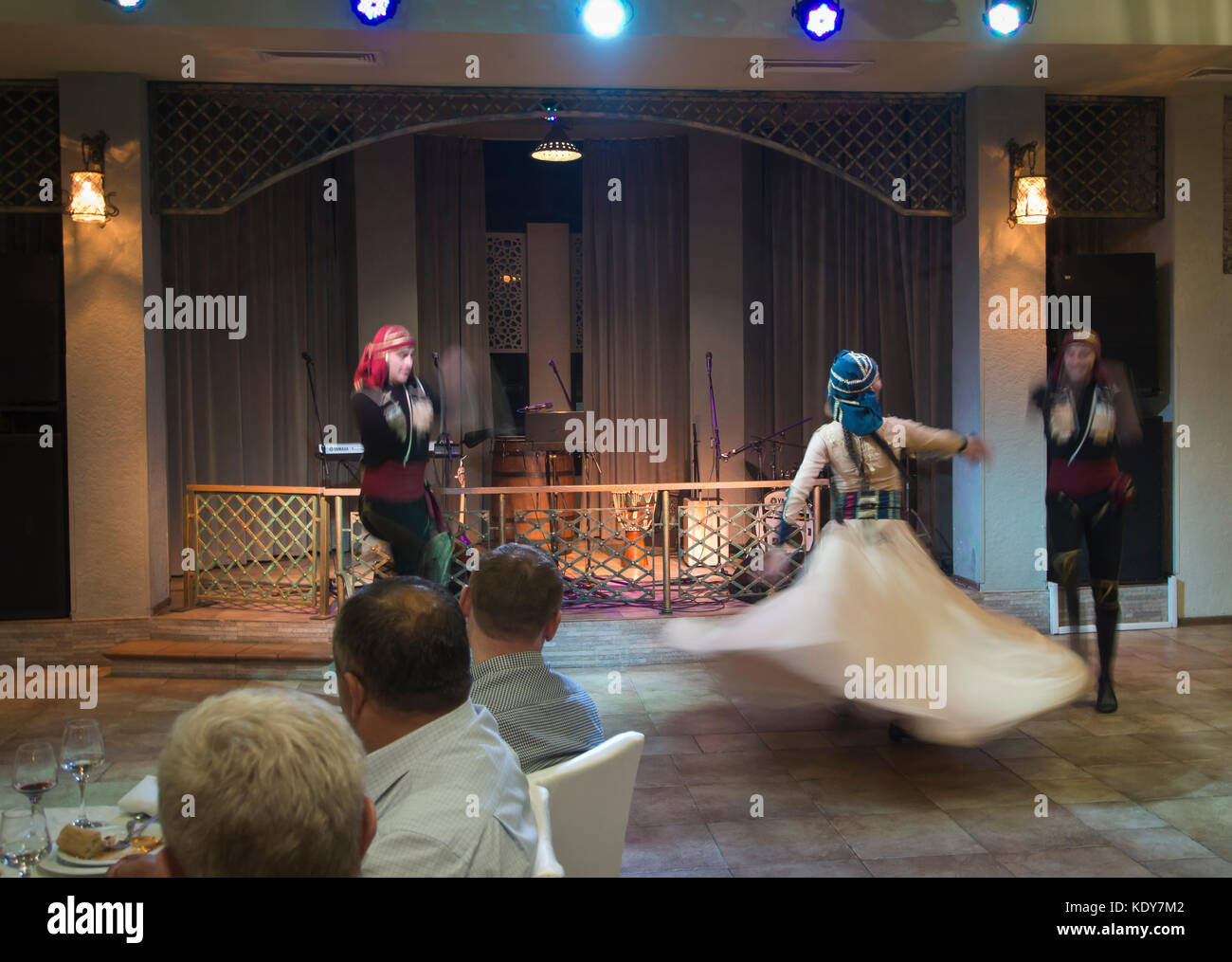 Georgian folk dancers in traditional costumes performing for tourists ...