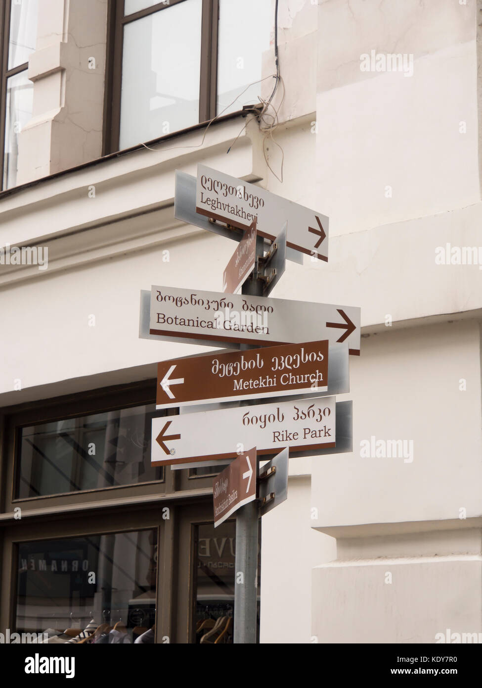Signpost with directions for tourists and locals in downtown Tbilisi ...