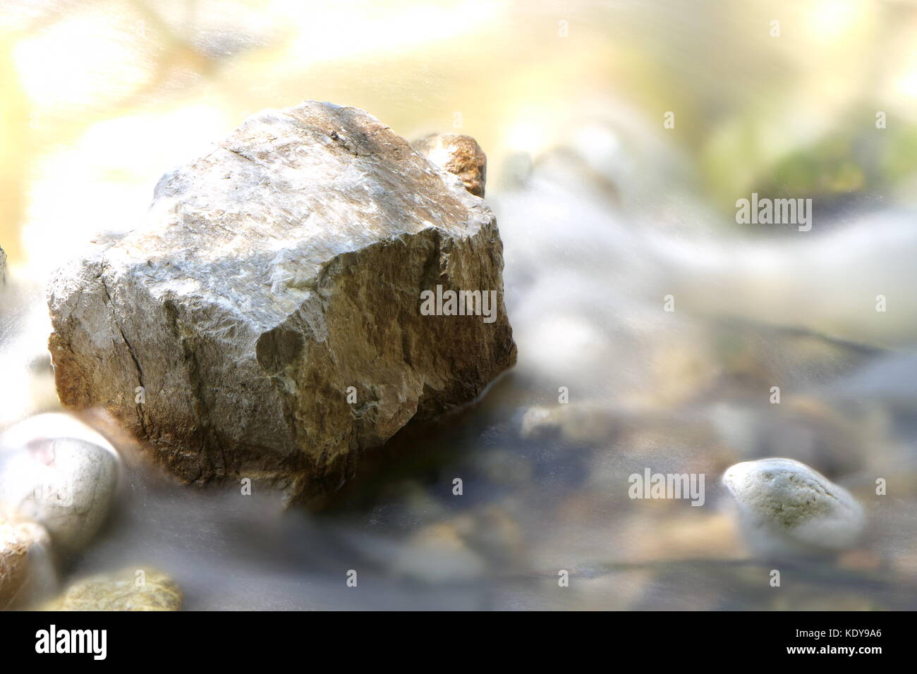 Floating rock in river Stock Photo - Alamy