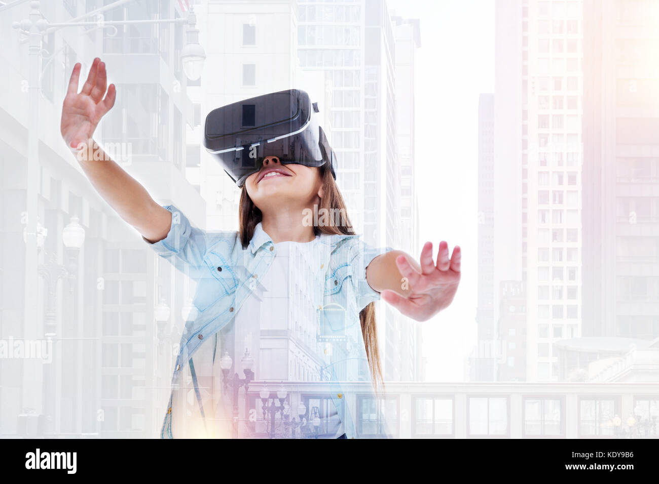Petite girl testing new VR headset Stock Photo - Alamy