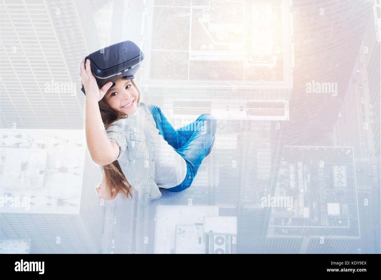 Top view of girl removing her VR headset Stock Photo - Alamy