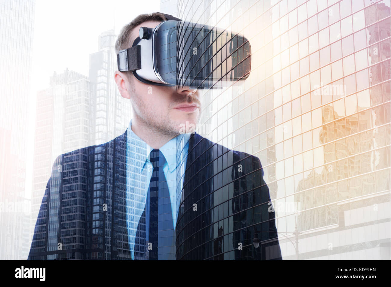 Handsome man in VR headset posing on urban background Stock Photo - Alamy