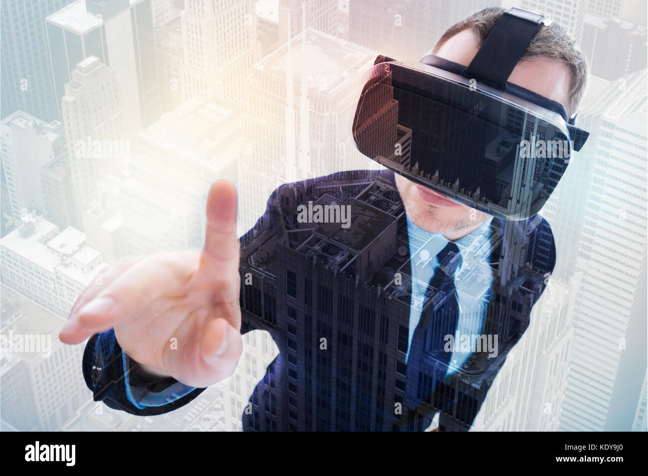 Top view of businessman in VR headset raising finger Stock Photo - Alamy